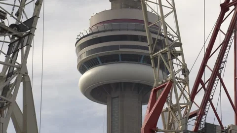 Massive condo construction cranes dwarf ... | Stock Video | Pond5