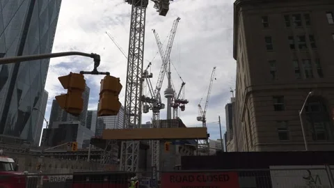 Massive condo construction cranes dwarf ... | Stock Video | Pond5