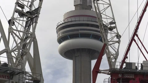 Massive condo construction cranes dwarf ... | Stock Video | Pond5