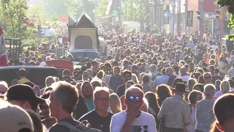 Massive crowd of people in small city st... | Stock Video | Pond5