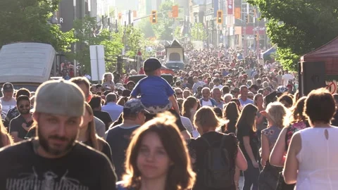 Massive crowd of people in small city st... | Stock Video | Pond5