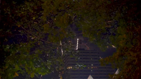 Massive fireworks exploding behind skysc... | Stock Video | Pond5