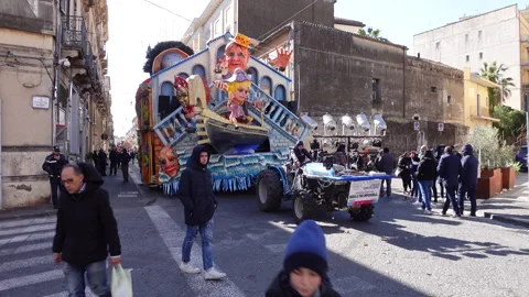 Massive statues drive through Acireale d... | Stock Video | Pond5