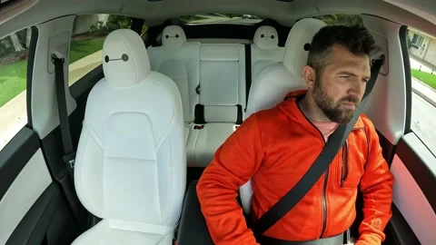 Mature male driver inside Tesla Model Y ... | Stock Video | Pond5