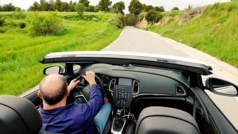 Mature Man Driving Convertible Sports Ca... | Stock Video | Pond5