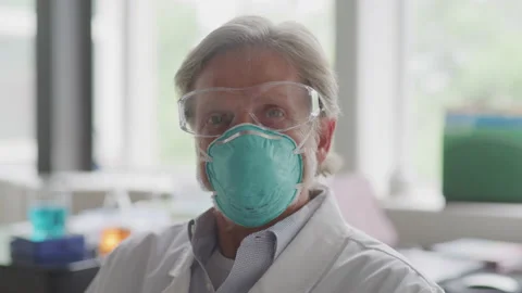 Mature Older Scientist in Lab Coat and S... | Stock Video | Pond5