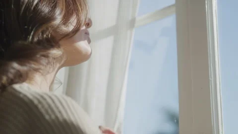 Mature Woman Slowly Opens Window Curtain... | Stock Video | Pond5