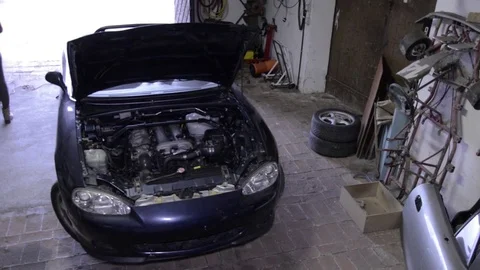 Mazda mx5 miata far high view open hood | Stock Video | Pond5