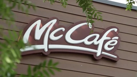 mccafe mcdonalds logo on side of restaur... | Stock Video | Pond5