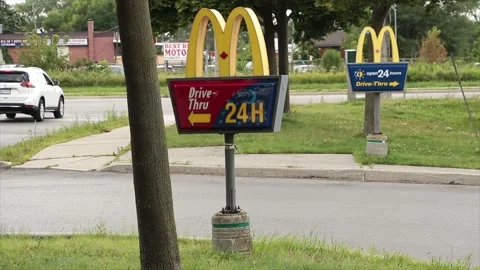 mcdonalds drive thru signs on posts at e... | Stock Video | Pond5