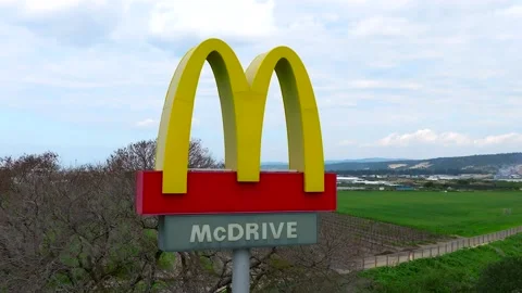 McDonalds sign and McDrive banner rotati... | Stock Video | Pond5
