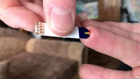 Measuring insulin levels at home with a ... | Stock Video | Pond5