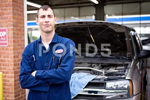 Mechanic: Standing By Automotive Bay - Stock Image - Everypixel