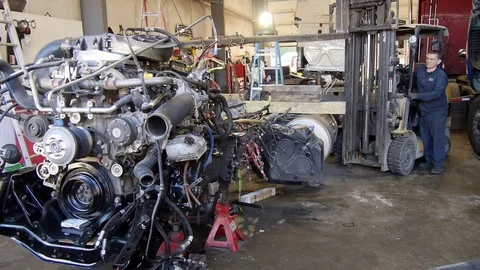 Mechanics working on semi truck diesel e... | Stock Video | Pond5