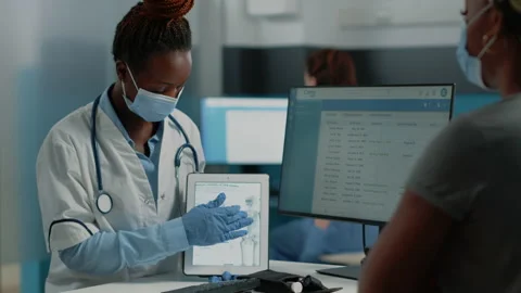 Medic showing tablet with human skeleton... | Stock Video | Pond5