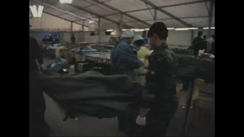 Medical personnel identificating dead bo... | Stock Video | Pond5