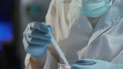 Medical scientist stirring and mixing re... | Stock Video | Pond5