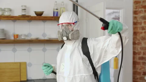 Medical staff in PPE suit spraying disin... | Stock Video | Pond5