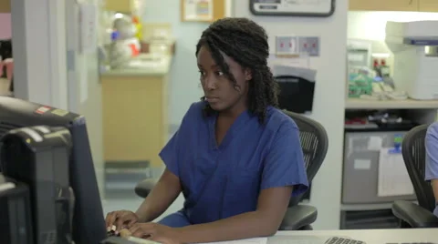 Medical Staff Working At Nurses Station | Stock Video | Pond5