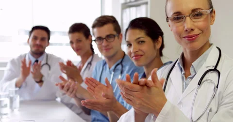 Medical team clapping at camera | Stock Video | Pond5