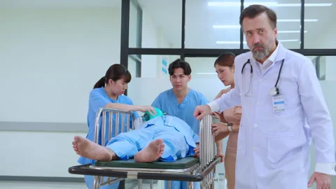 Medical team in urgency pushing gurney o... | Stock Video | Pond5
