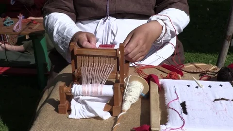 Medieval loom hand weaving | Stock Video | Pond5