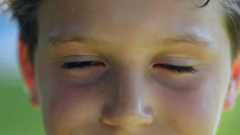 Meditative young boy child closing eyes.... | Stock Video | Pond5