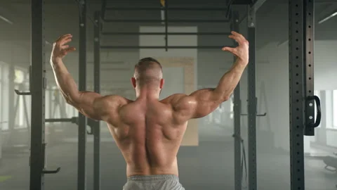 Medium shot back view of bodybuilder sho... | Stock Video | Pond5