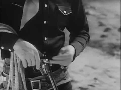 Medium shot of cowboy reloading his pist... | Stock Video | Pond5