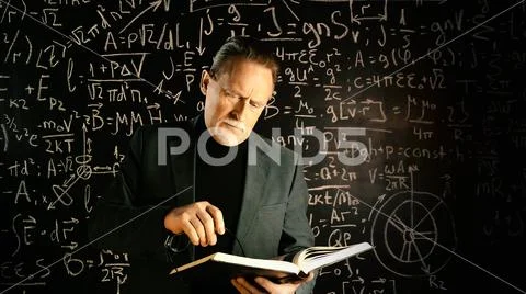 Medium shot of male university professor with book in hands. ~ Hi Res ...