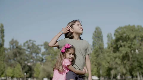 Medium shot of scared sister hugging her... | Stock Video | Pond5
