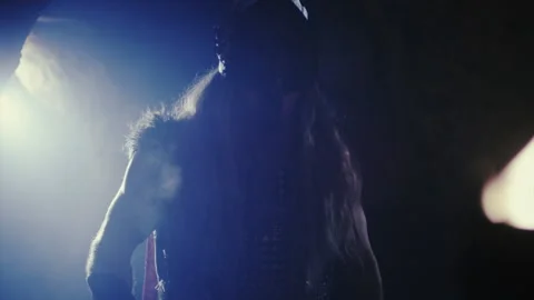 Medium shot of Thor walking into the cav... | Stock Video | Pond5