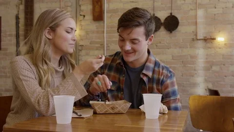 Medium shot of woman kissing man on chee... | Stock Video | Pond5