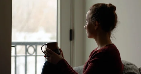 Medium shot of young woman quietly watch... | Stock Video | Pond5
