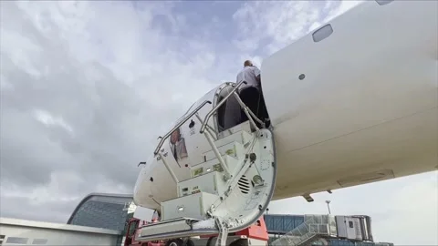 Medium size jet crew climbing stairs to ... | Stock Video | Pond5