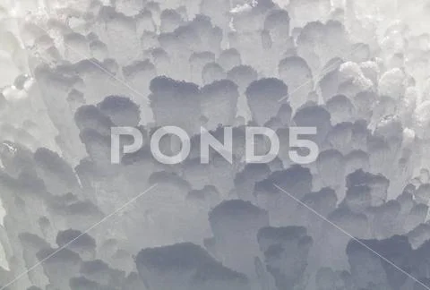 Melting ice background Block of blue smooth melting ice, close-up ...