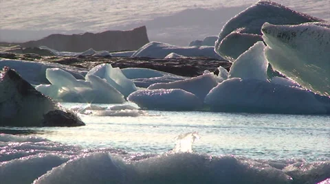 Melting iceberg backlit in the sunset, g... | Stock Video | Pond5
