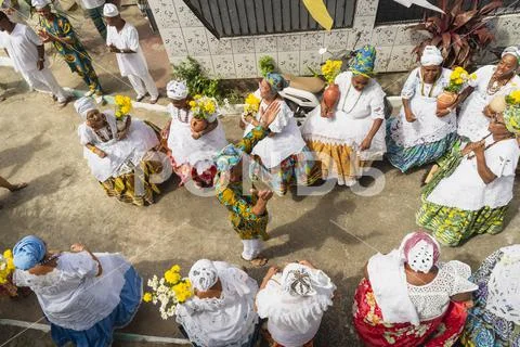 Members of the Candomble religion dancing and singing dressed in ...