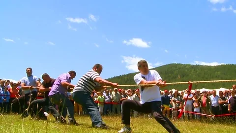 Men compete in a rope pulling" "Tug Of W... | Stock Video | Pond5