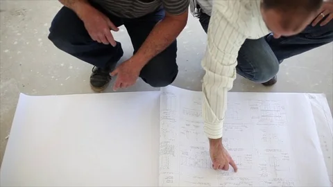 Men Reading Blueprints | Stock Video | Pond5