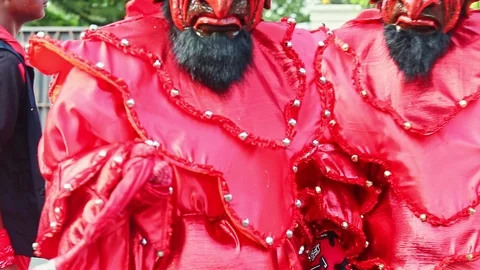 men in scary red devils costumes dance o... | Stock Video | Pond5