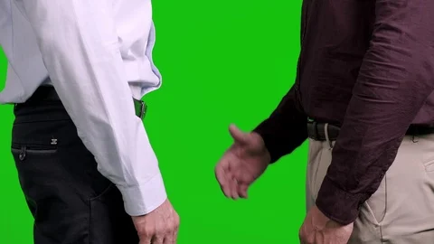 Men shaking hands pose with green screen... | Stock Video | Pond5