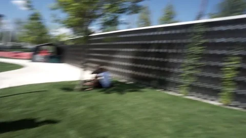 Men stand on the grass and throw a cap a... | Stock Video | Pond5