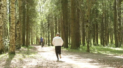 Men take a morning jog in the Park. | Stock Video | Pond5