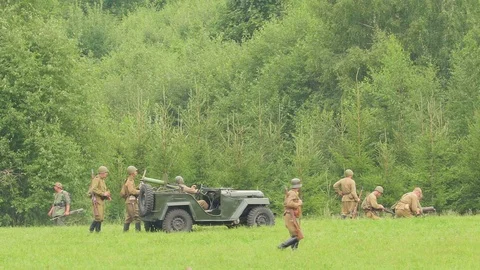 The men in uniform riding on the militar... | Stock Video | Pond5