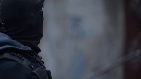 Men Wearing Tactical West and Black Mask... | Stock Video | Pond5