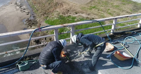 Men working on a bridge construction | Stock Video | Pond5