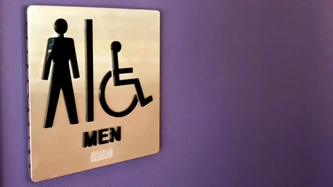 Men's restroom sign on purple wall in of... | Stock Video | Pond5