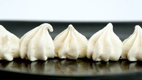 meringue stands on a black background Th... | Stock Video | Pond5