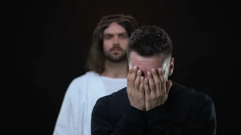 Messiah in crown of thorns uncovering cr... | Stock Video | Pond5